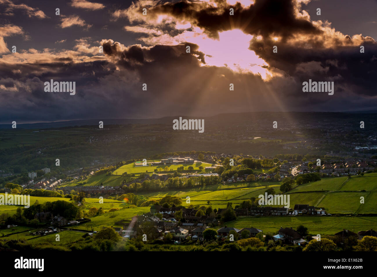 filtered sun rays on a town landscape Stock Photo - Alamy