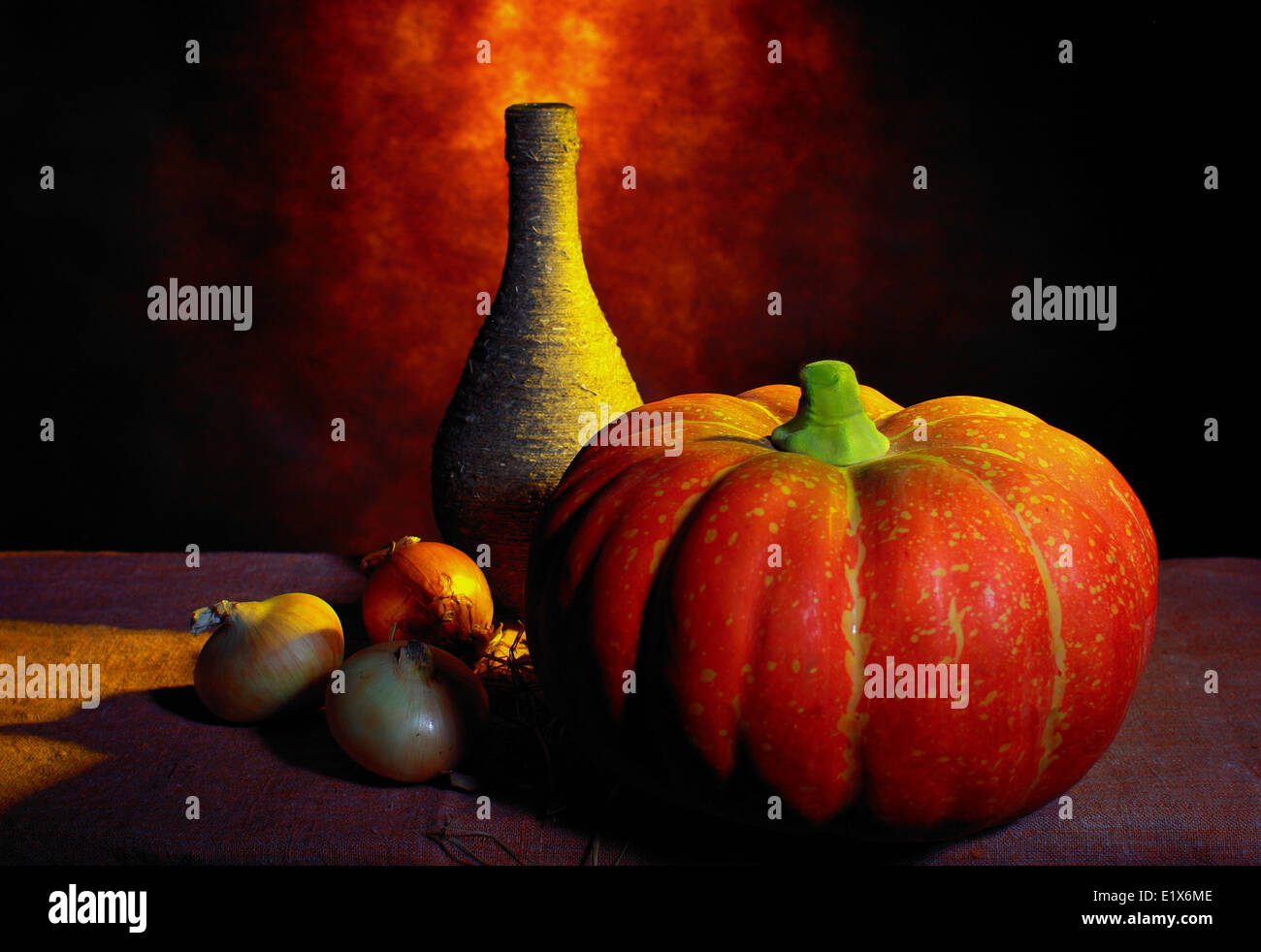 Still life with pumpkin and onions Stock Photo - Alamy