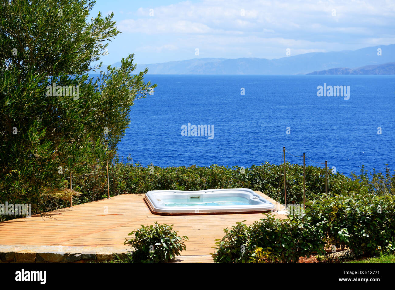 The outdoor jacuzzi at luxury hotel with a sea view, Crete, Greece ...