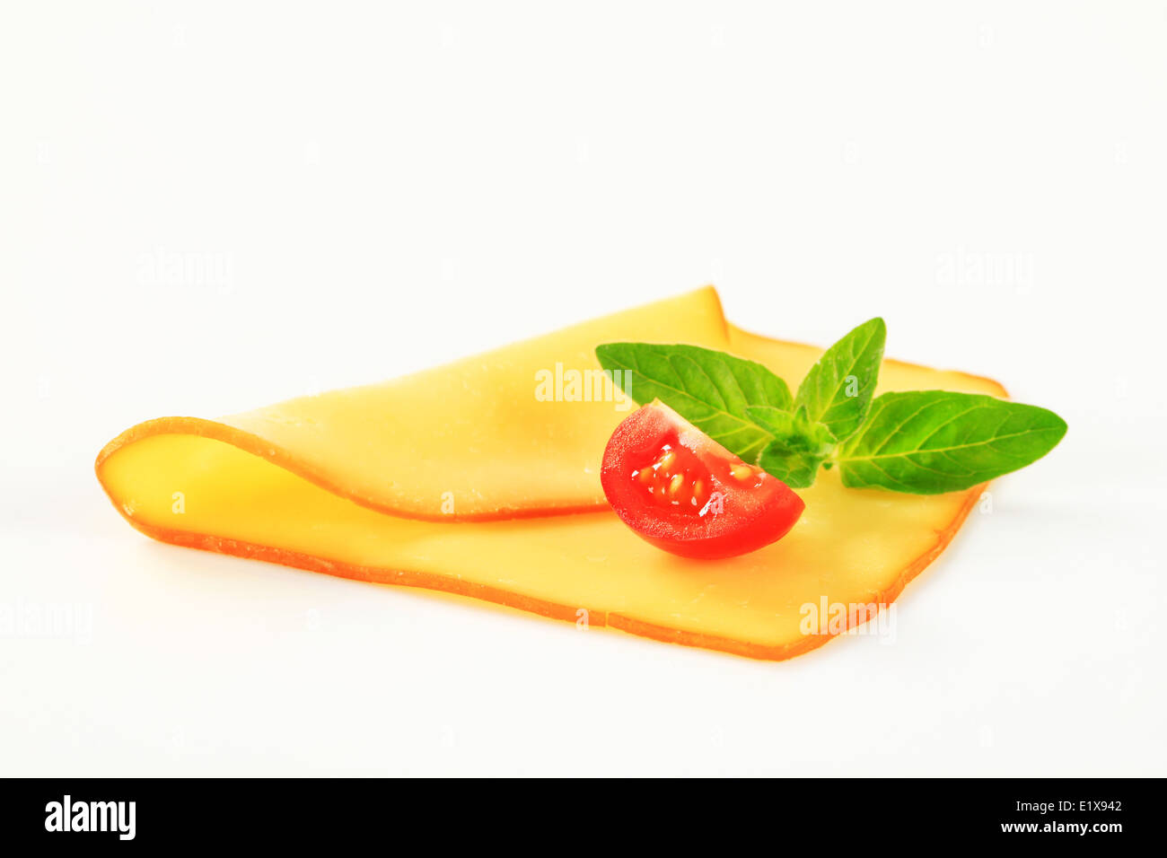Thin slice of smoked yellow cheese Stock Photo - Alamy