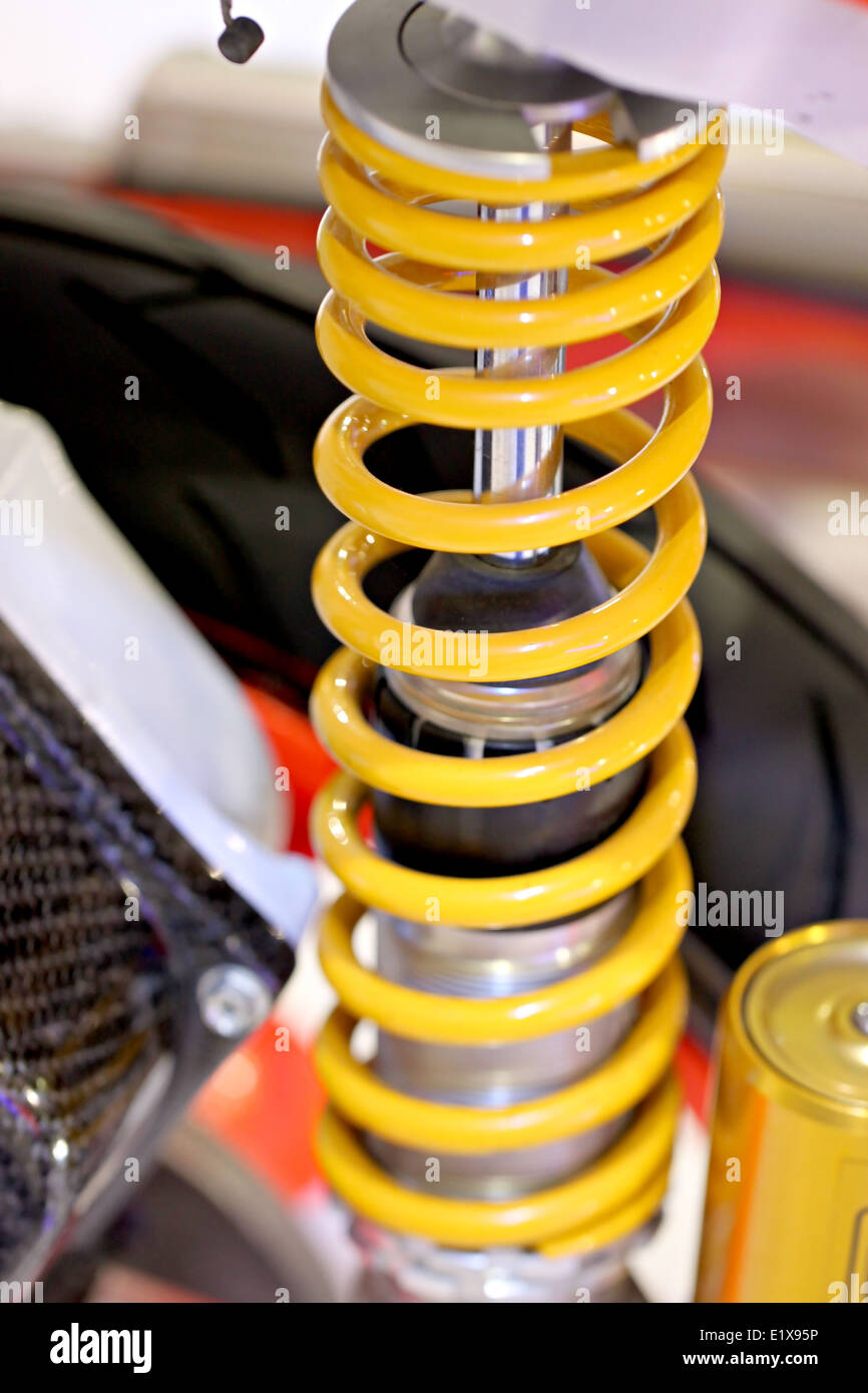 yellow motorcycle shock absorbers for background Stock Photo - Alamy