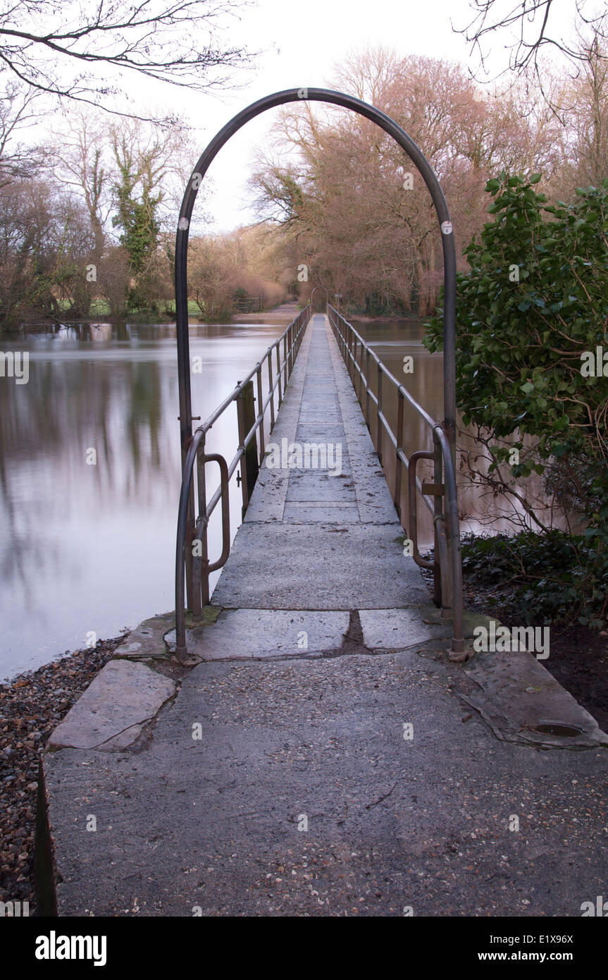 The ford at Moreton in winter, after heavy rain. A long pedestrian ...