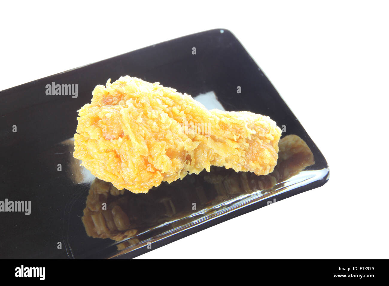 fried chicken in black dish of isolated on white background Stock Photo ...