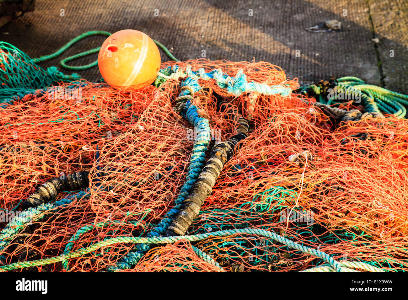 Fishing net orange fishnet white yellow float outdoor Stock Photo - Alamy