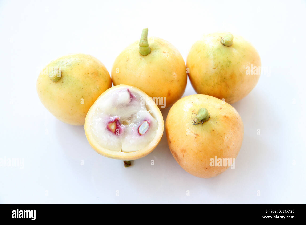 Baccaurea ramiflora or burmese grapes peeling on white background Stock ...