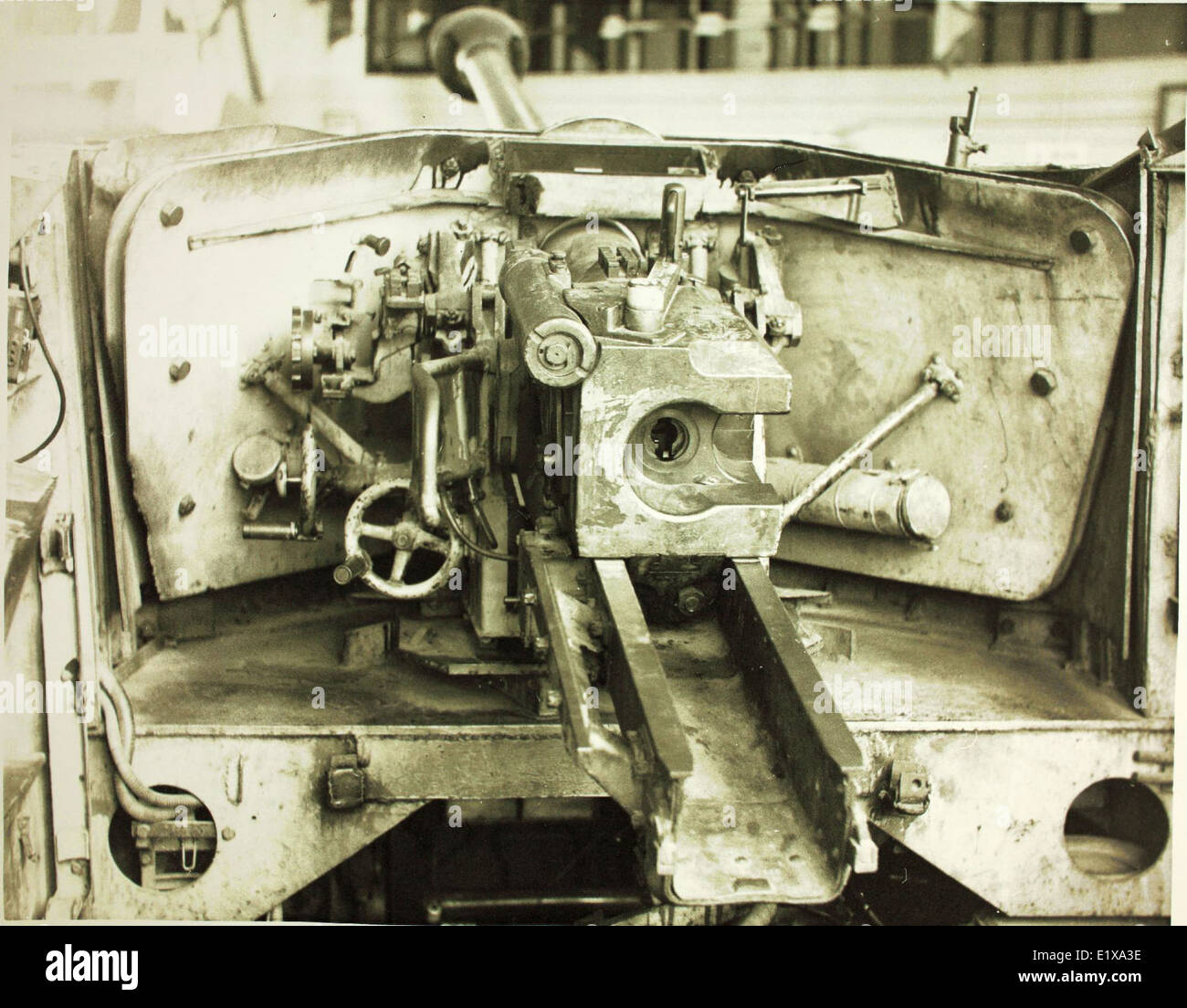 This image shows a historical tank displayed in a museum, offering a ...