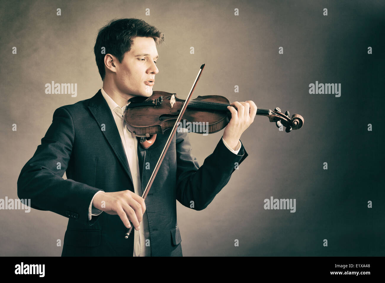 Man violinist playing violin. Classical music art Stock Photo - Alamy