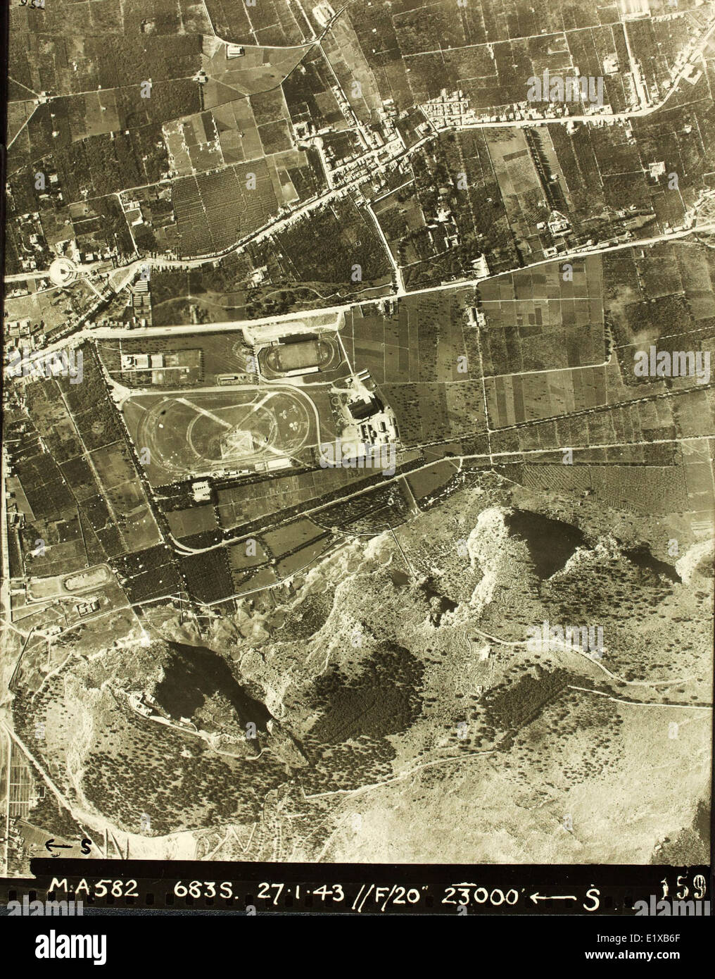 This aerial reconnaissance photo from World War II, captured between ...