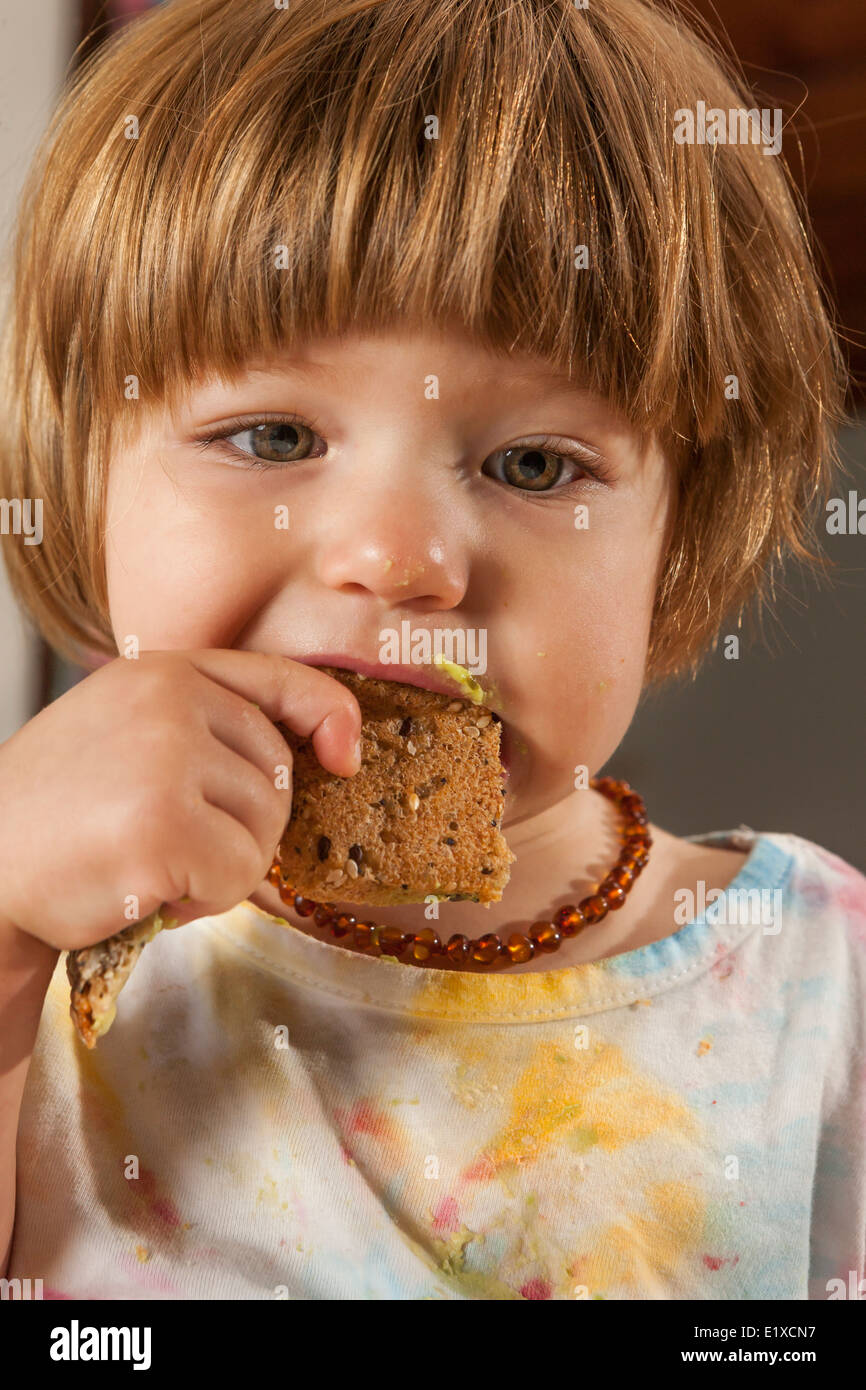 Baby eating alone hi-res stock photography and images - Alamy