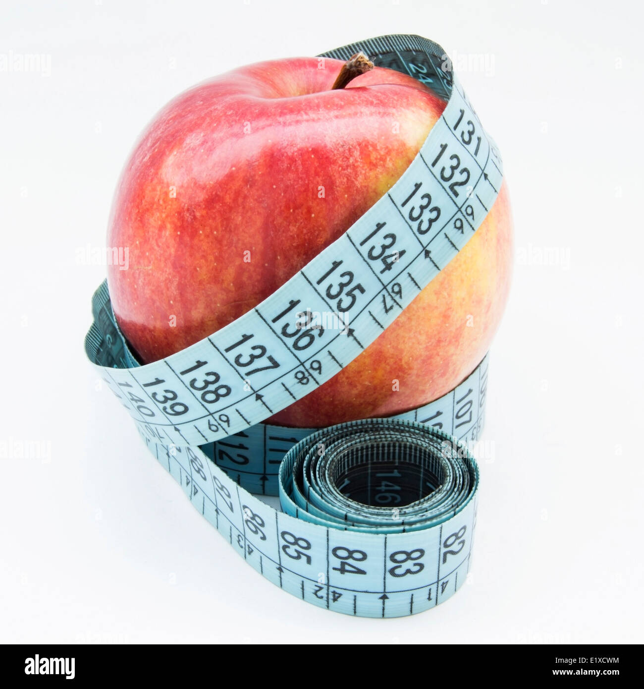 Apple and tape measure Stock Photo - Alamy