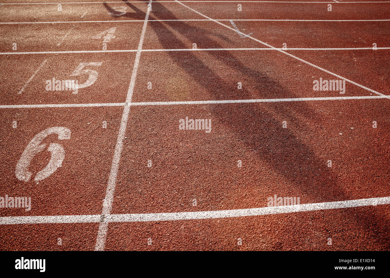 number on running track with shadow Stock Photo - Alamy