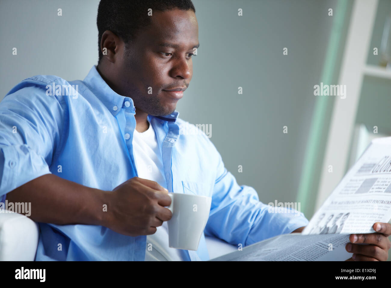 American student reading newspaper hi-res stock photography and images ...