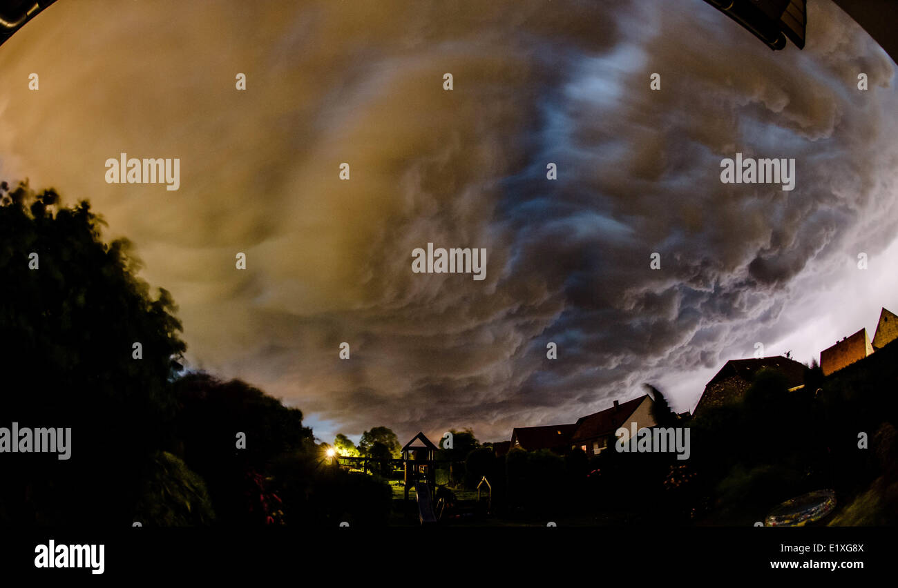 Geseke, Germany. 09th June, 2014. Dark clouds move across Soermeke near ...