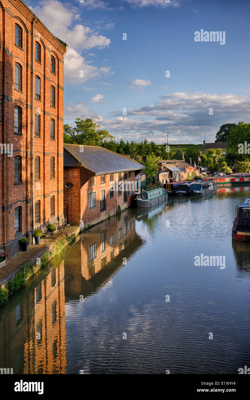 Blisworth Mill and narrowboats on the Grand Union Canal at sunrise ...