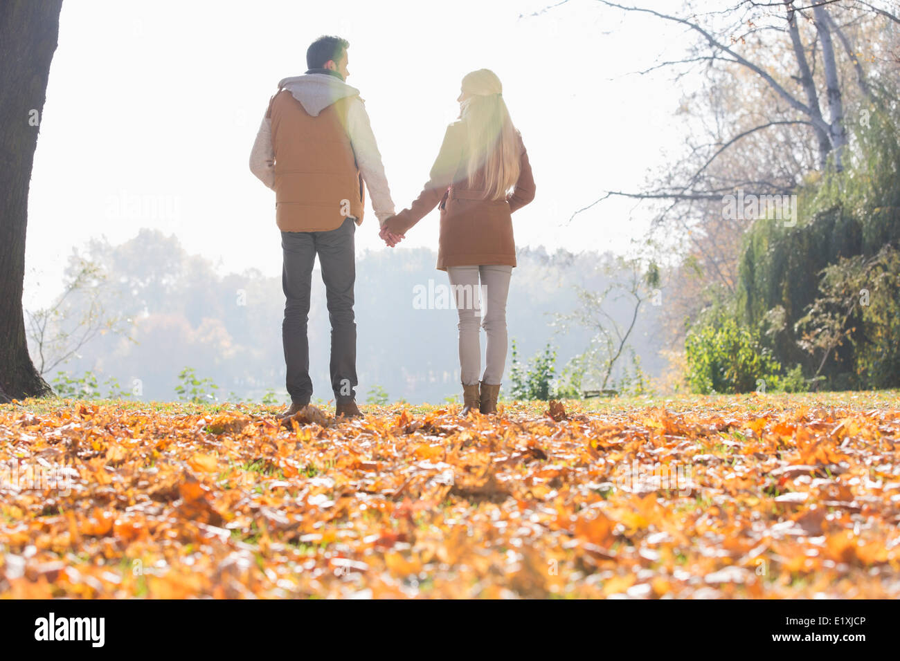 Two women holding hands back view hi-res stock photography and images ...