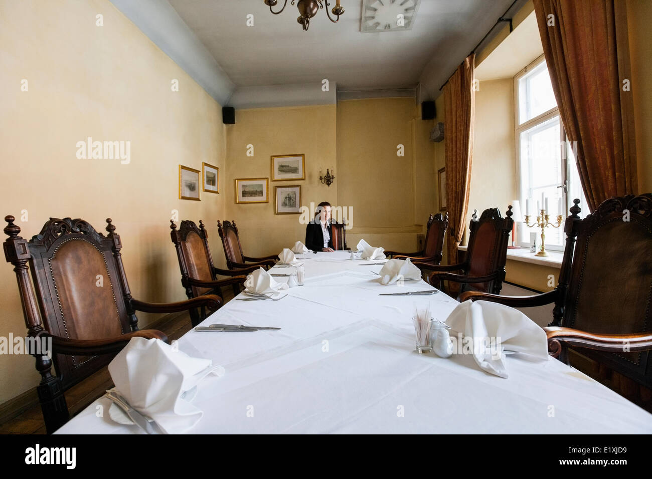 Female customer sitting at dining table in restaurant Stock Photo - Alamy