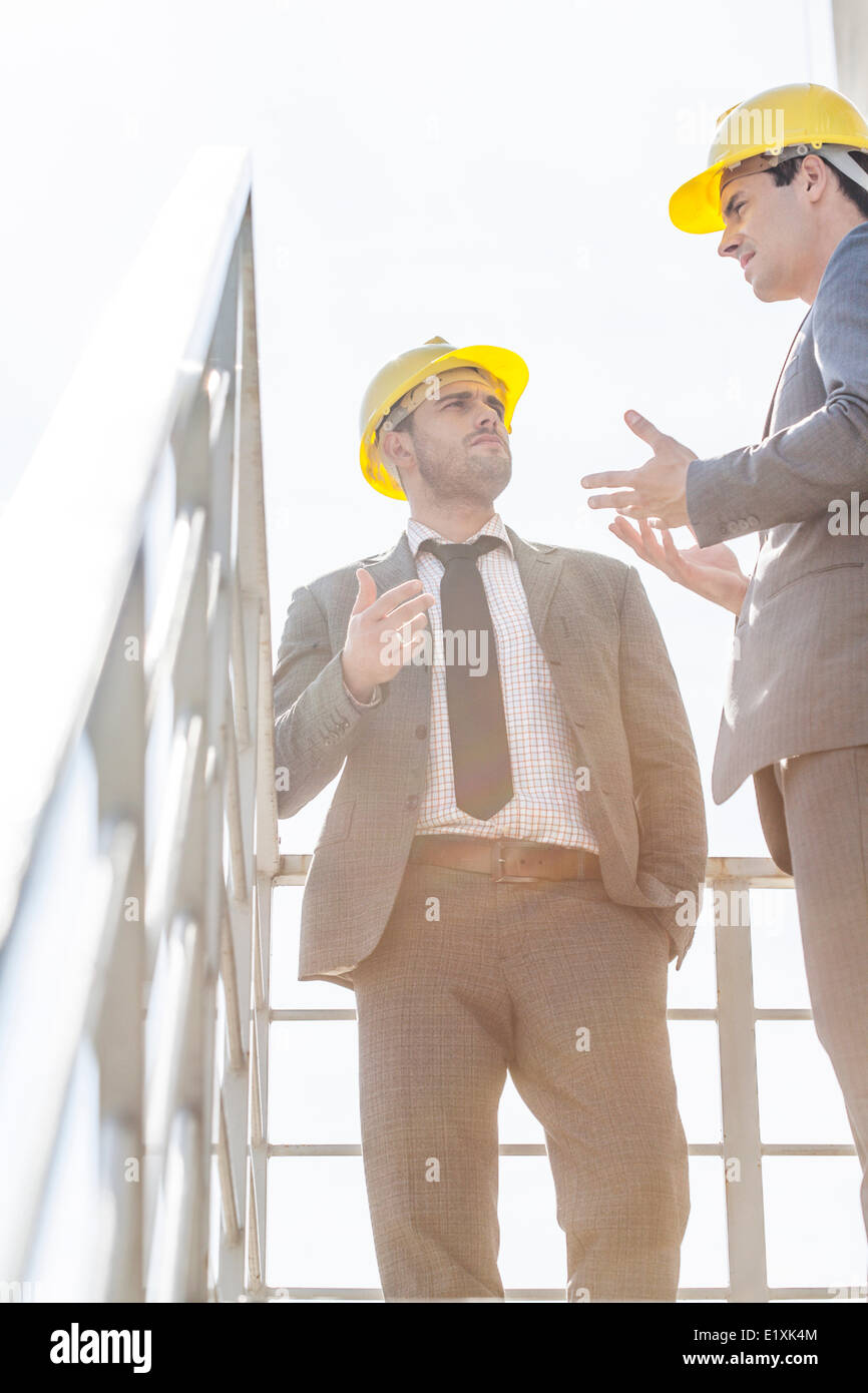 Business People In Hard Hats Standing Stock Photos & Business People In ...