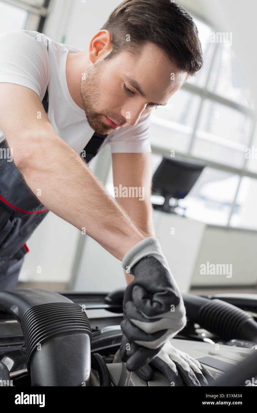 Young person repairing car hi-res stock photography and images - Alamy