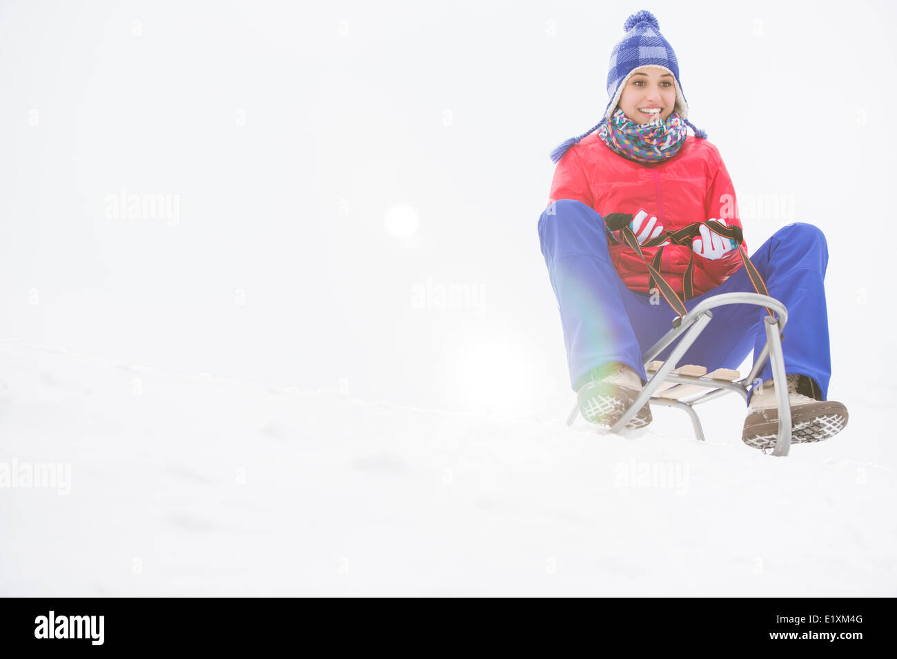 Person sledging in snow hi-res stock photography and images - Alamy
