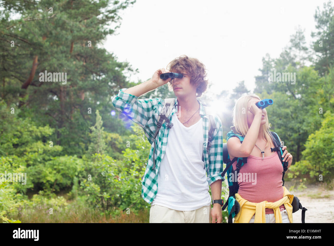 Man with binoculars tree hi-res stock photography and images - Alamy