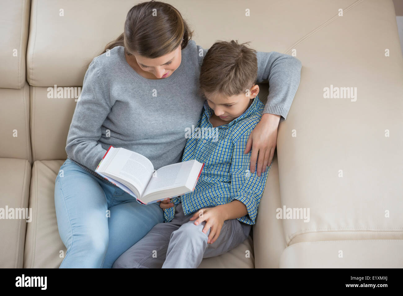 Mother son reading book learning hi-res stock photography and images ...