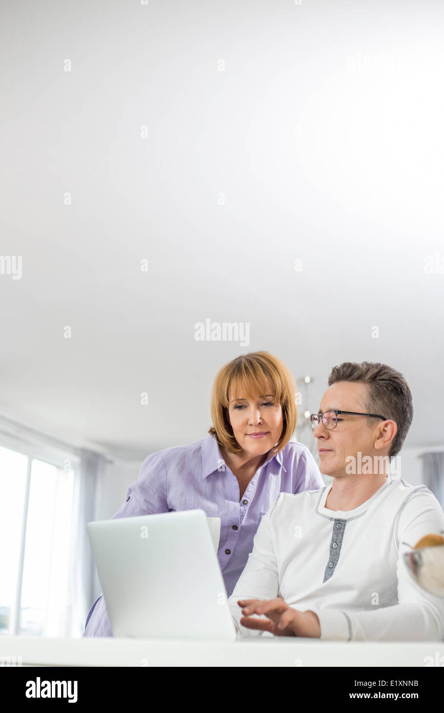 Couple using laptop together home hi-res stock photography and images ...