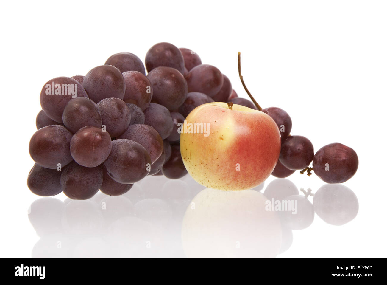 Apple and grapes on a white background Stock Photo - Alamy
