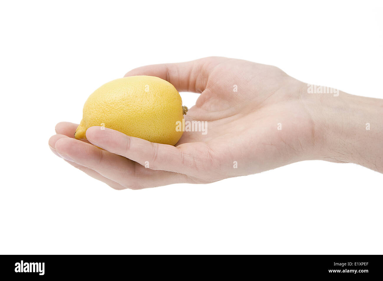 Yellow lemon in a hand Stock Photo - Alamy