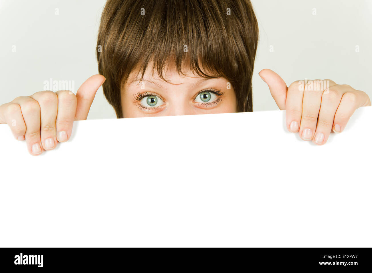 Girl hiding face behind paper hi-res stock photography and images - Alamy