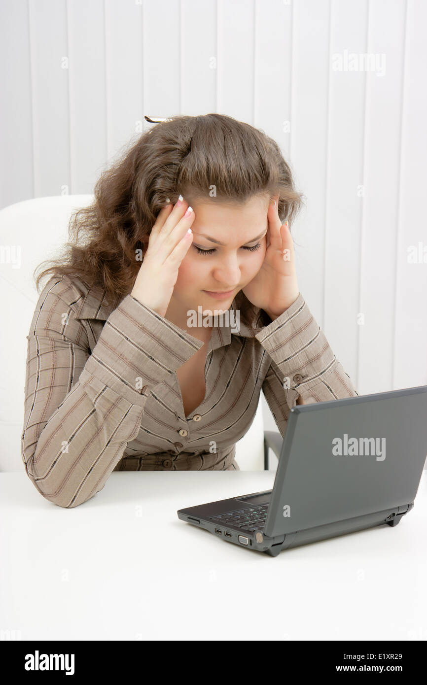 tired girl with laptop Stock Photo - Alamy