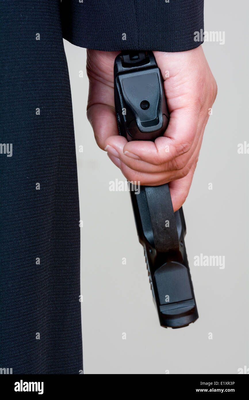 Woman holding gun hi-res stock photography and images - Alamy