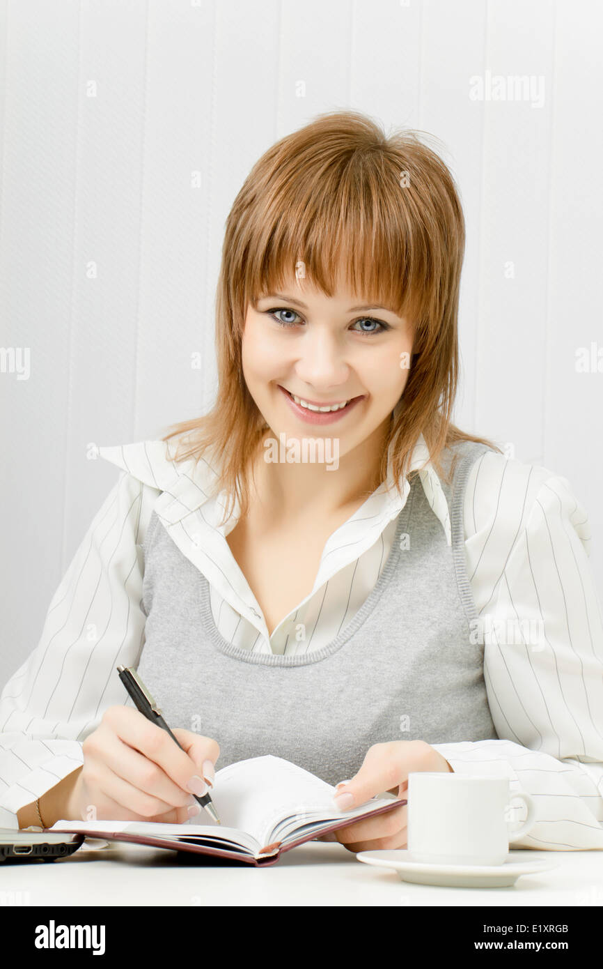 smiling girl with a notebook Stock Photo - Alamy