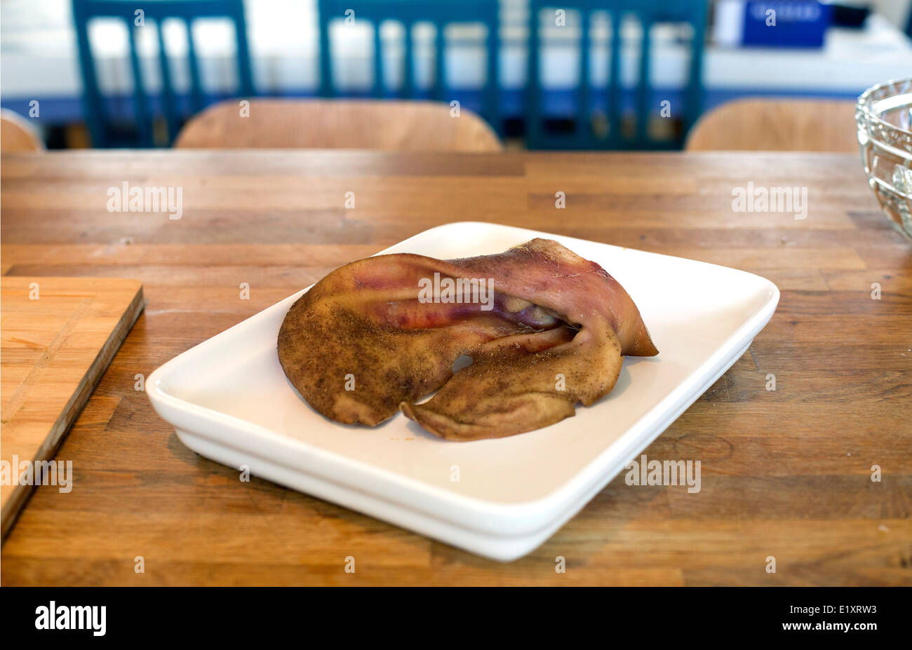 Pig's ear delicacy eating dish pork cooking cook Stock Photo - Alamy