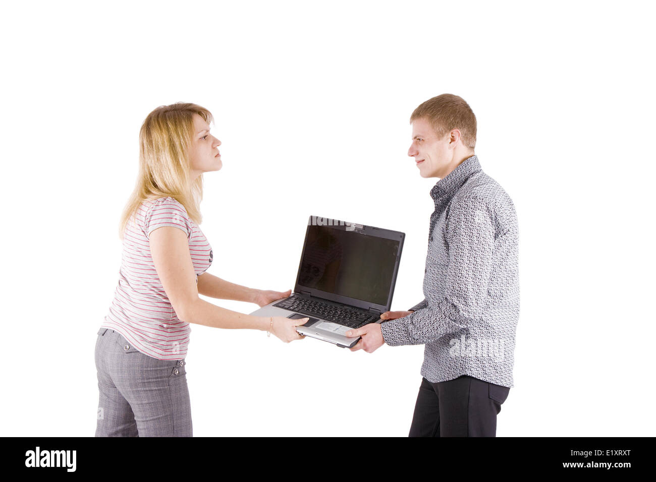 man and woman fighting over laptop Stock Photo - Alamy