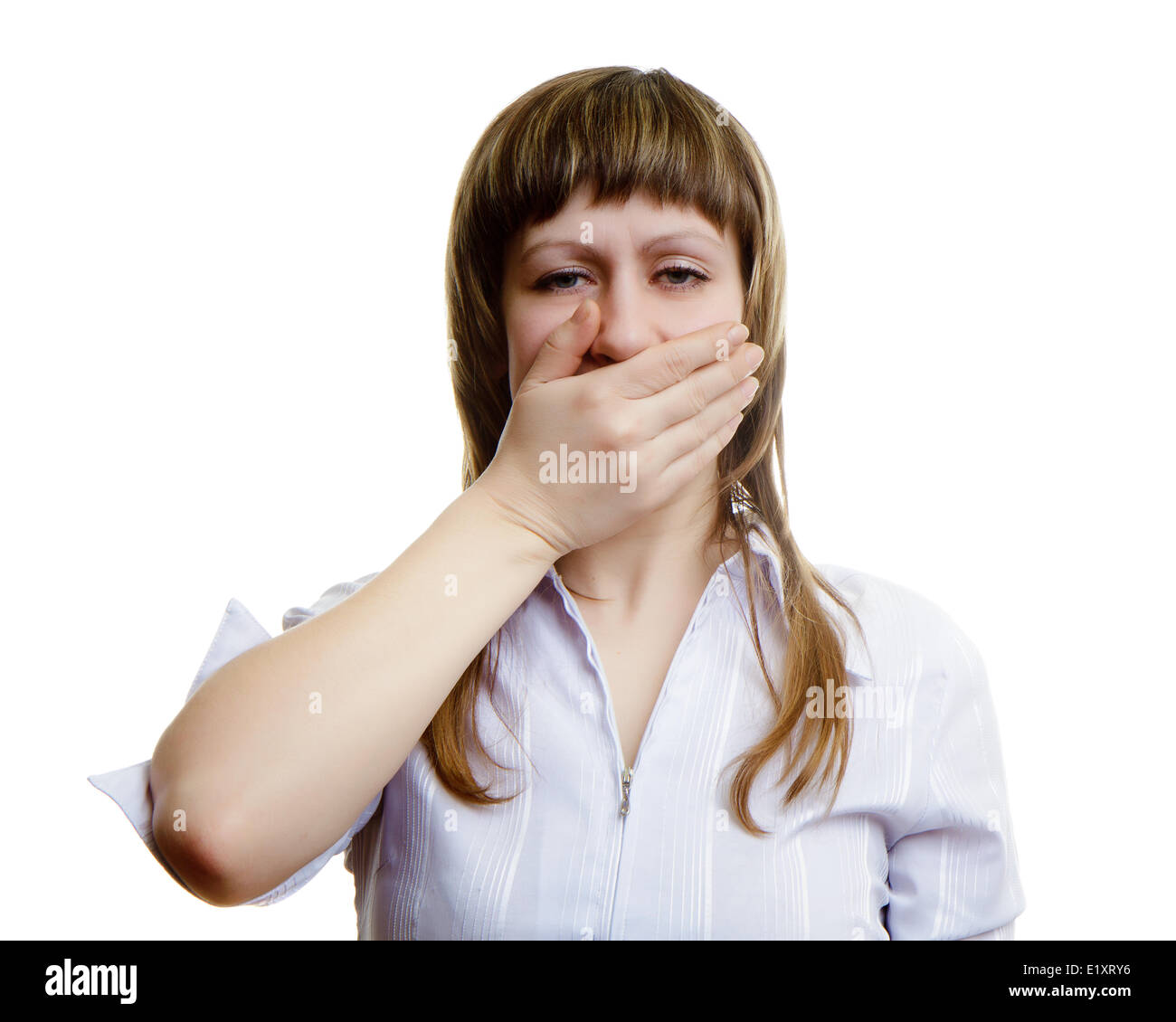 young girl covers her mouth with his hands Stock Photo - Alamy