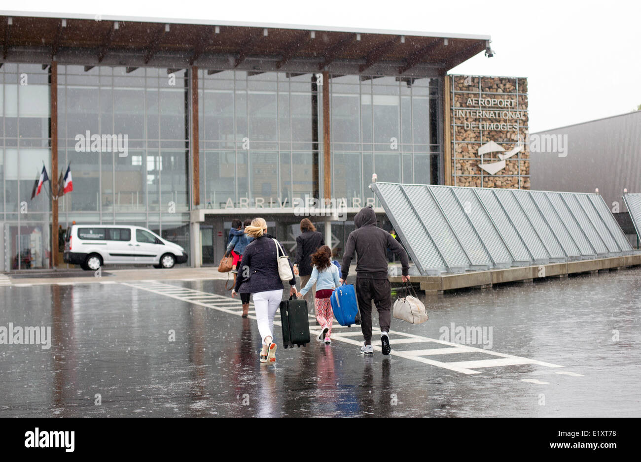 Running through rain to Limoges airport terminal Stock Photo - Alamy