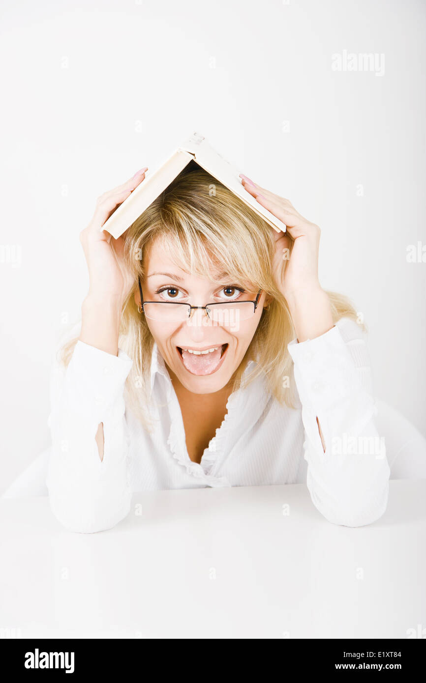 she hid under a book Stock Photo - Alamy