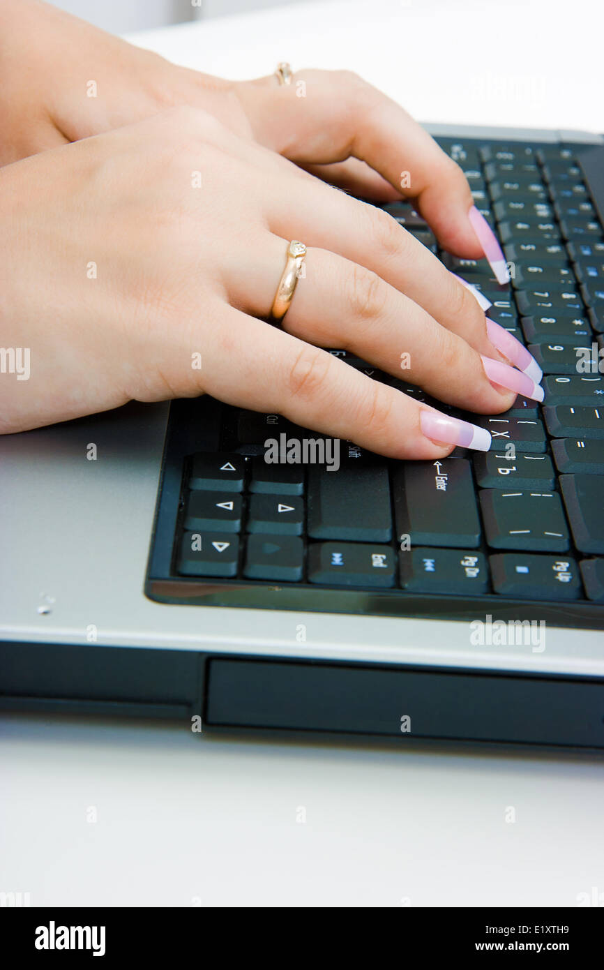 Women's hands on the laptop keyboard Stock Photo - Alamy