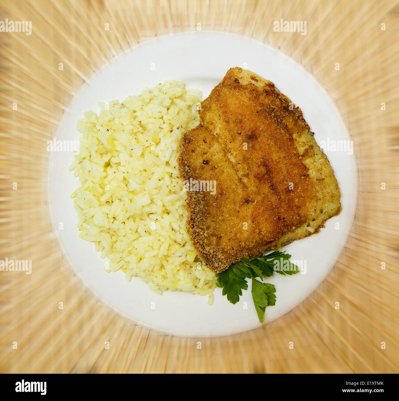 fried tilapia with rice garnish Stock Photo - Alamy