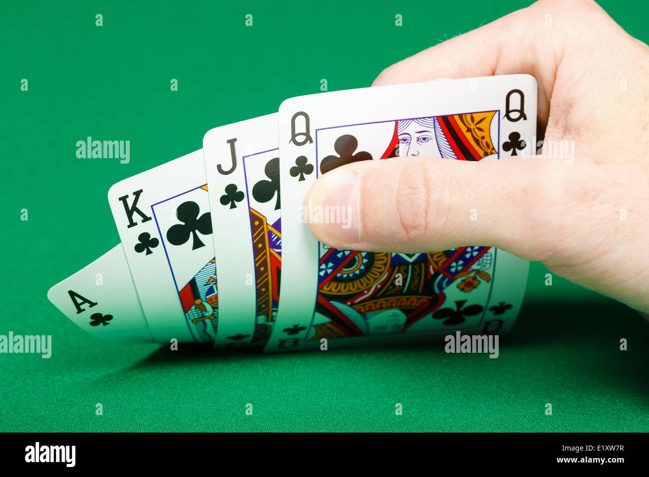 man's hand with four cards Stock Photo - Alamy