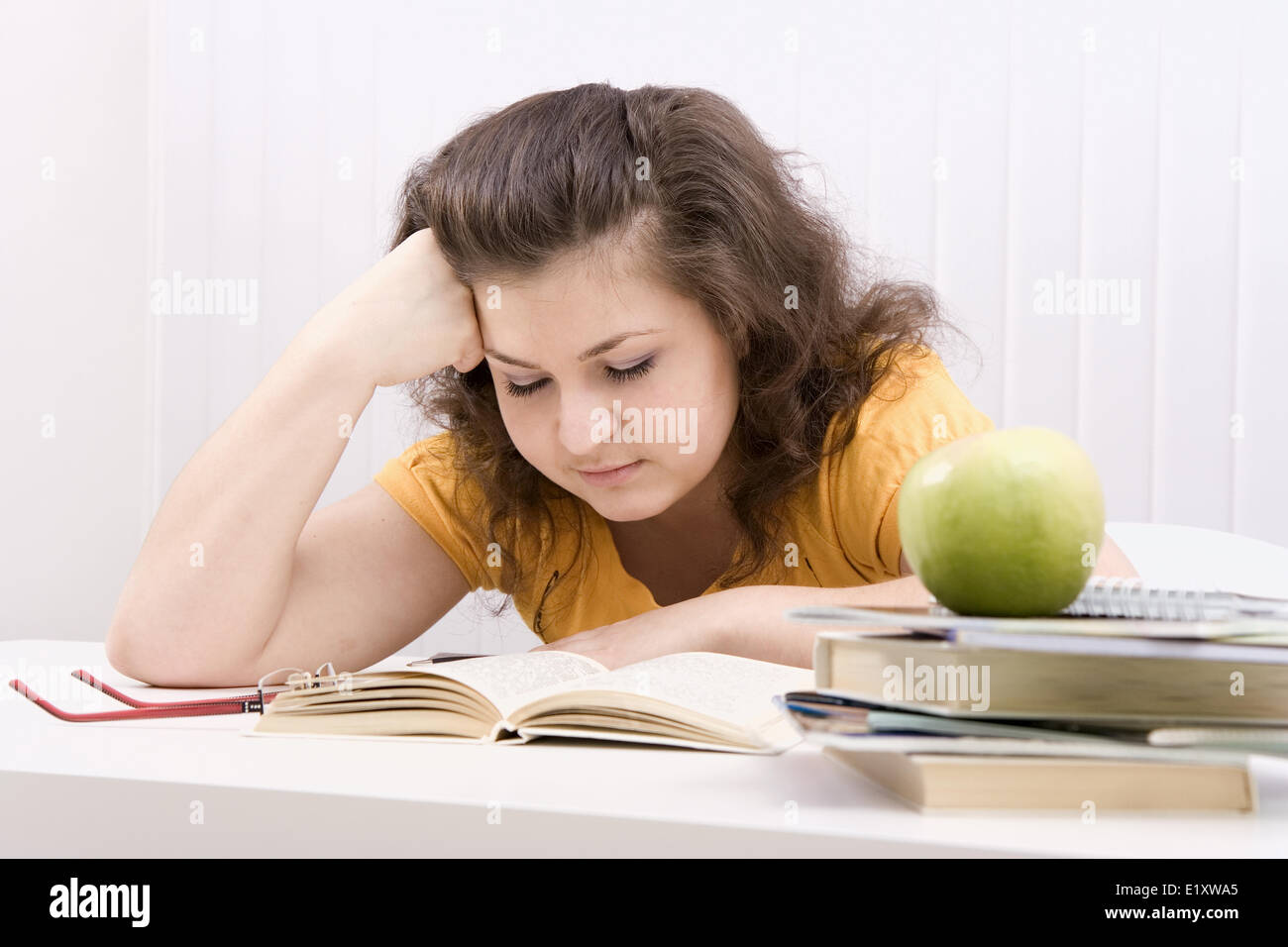 Tired student reading book hi-res stock photography and images - Alamy