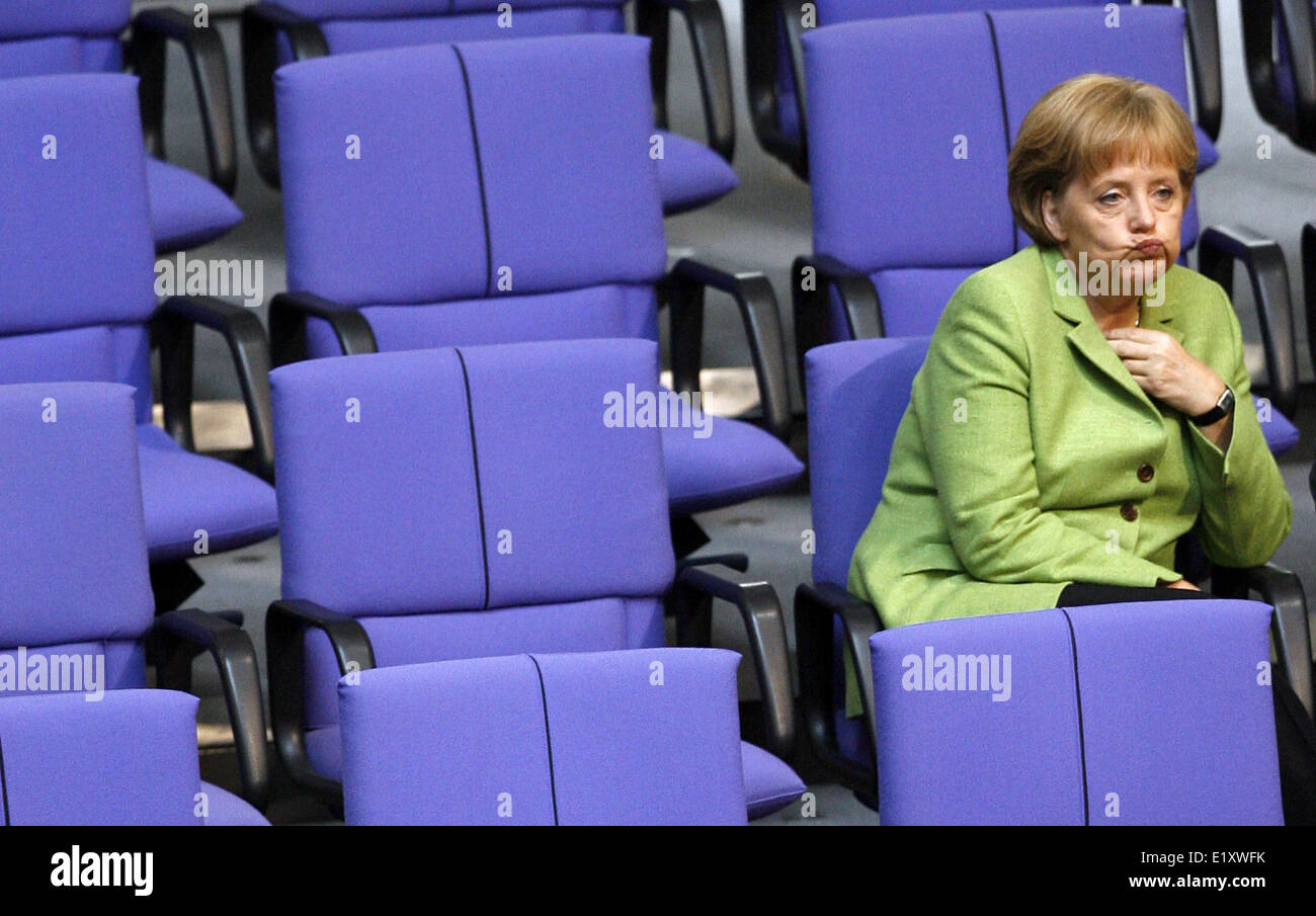 German chancellor Angela Merkel screws up her face in the Bundestag on ...