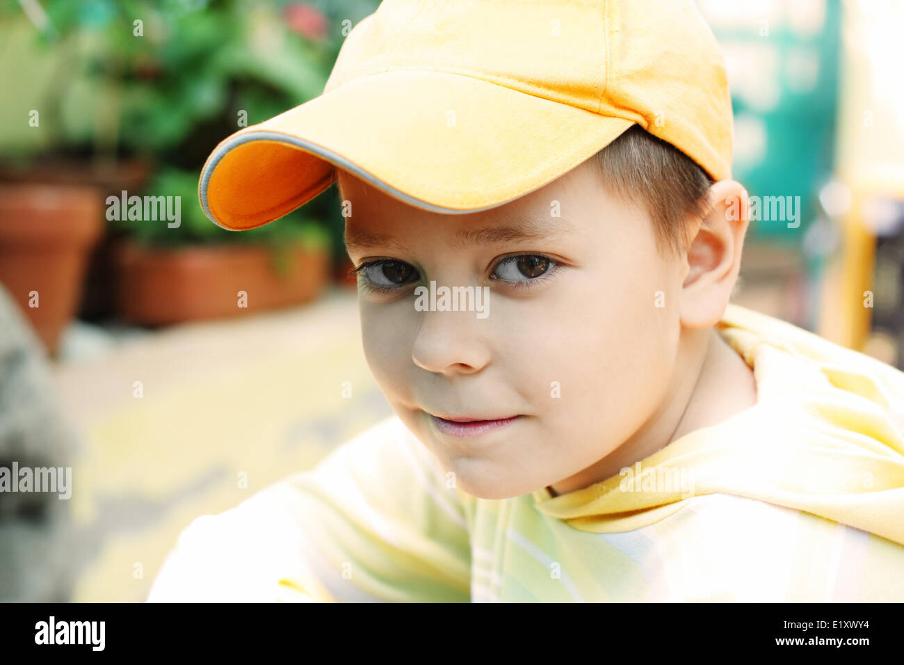 Boy in yellow cap Stock Photo - Alamy