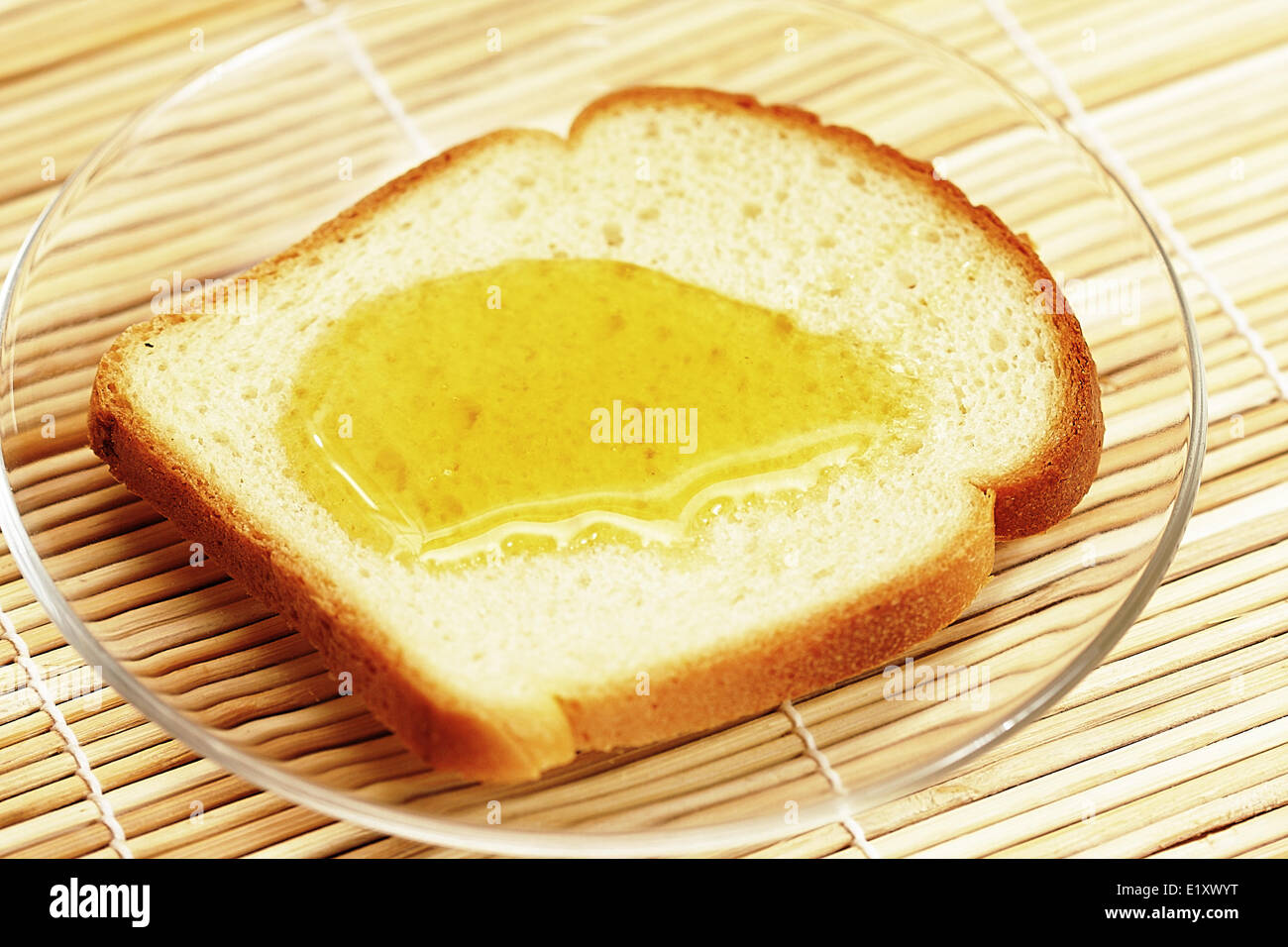 Toast with honey Stock Photo - Alamy
