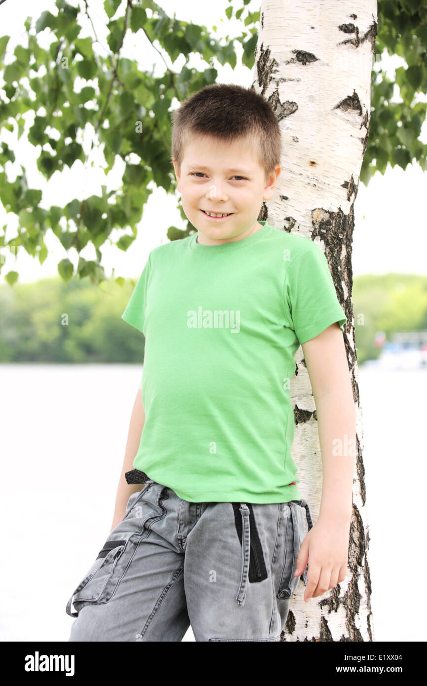 Boy at birch tree Stock Photo - Alamy