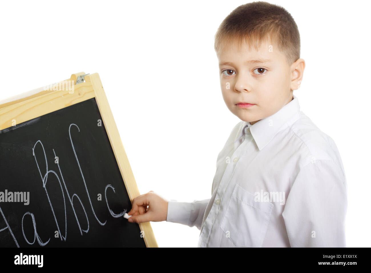 Schoolboy at blackboard Stock Photo - Alamy