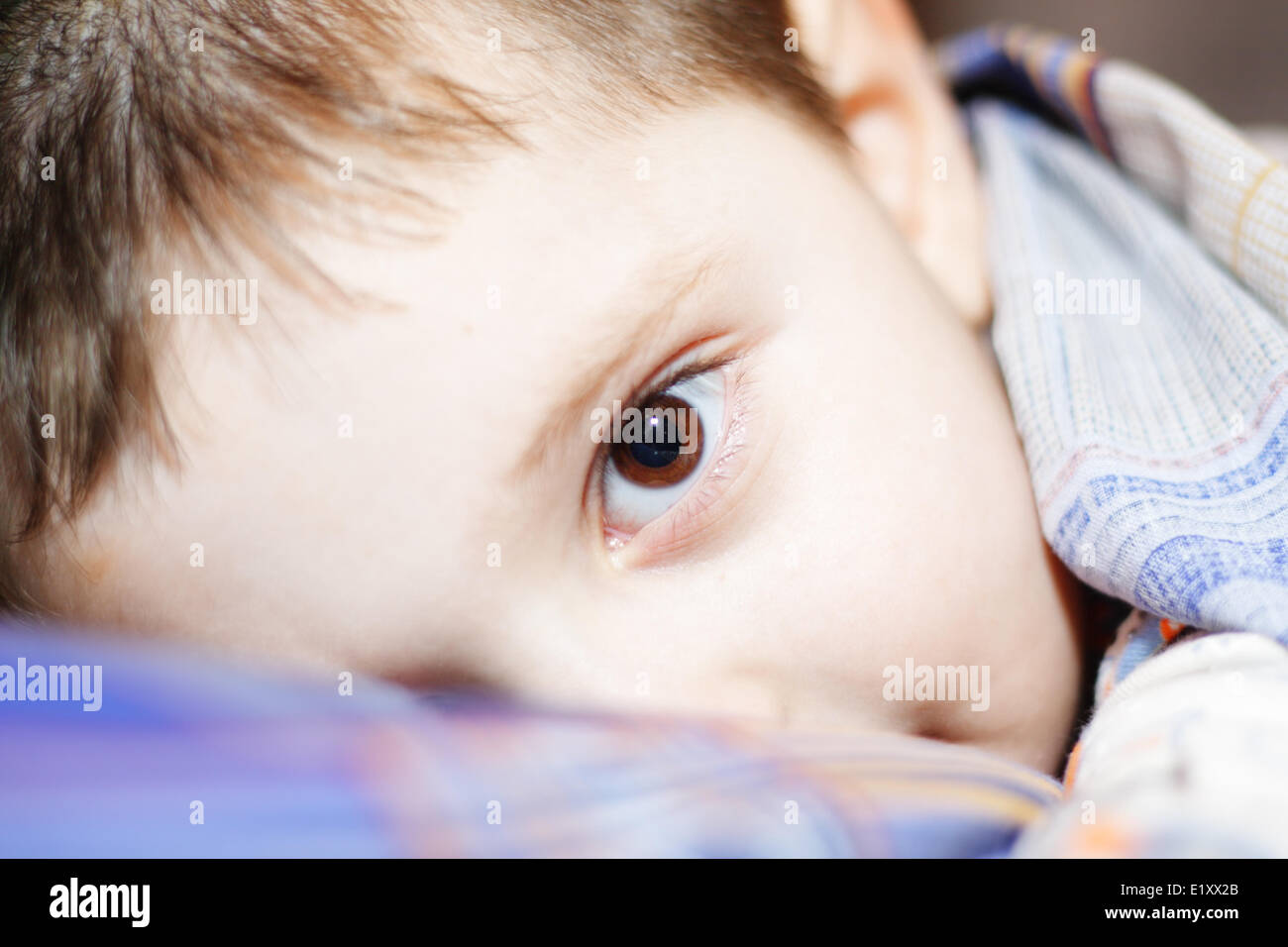 Watching with one eye Stock Photo - Alamy