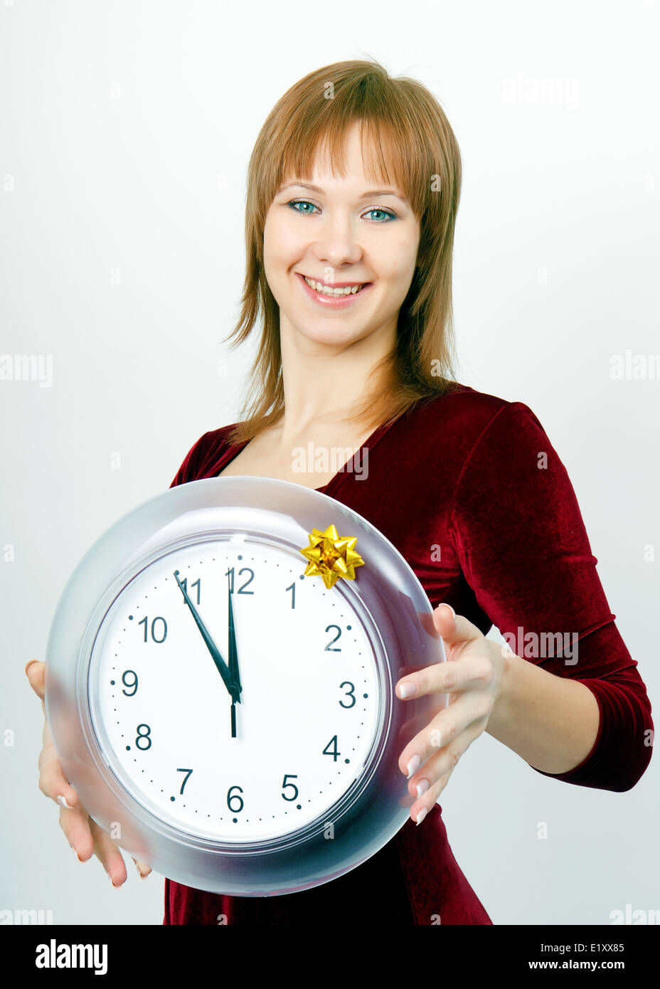 attractive girl with a clock Stock Photo - Alamy