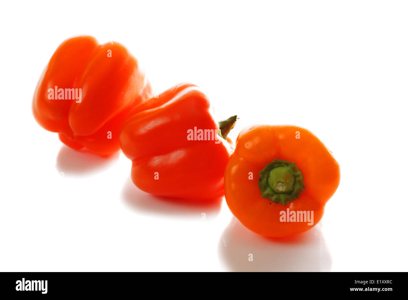 Three orange paprikas Stock Photo - Alamy