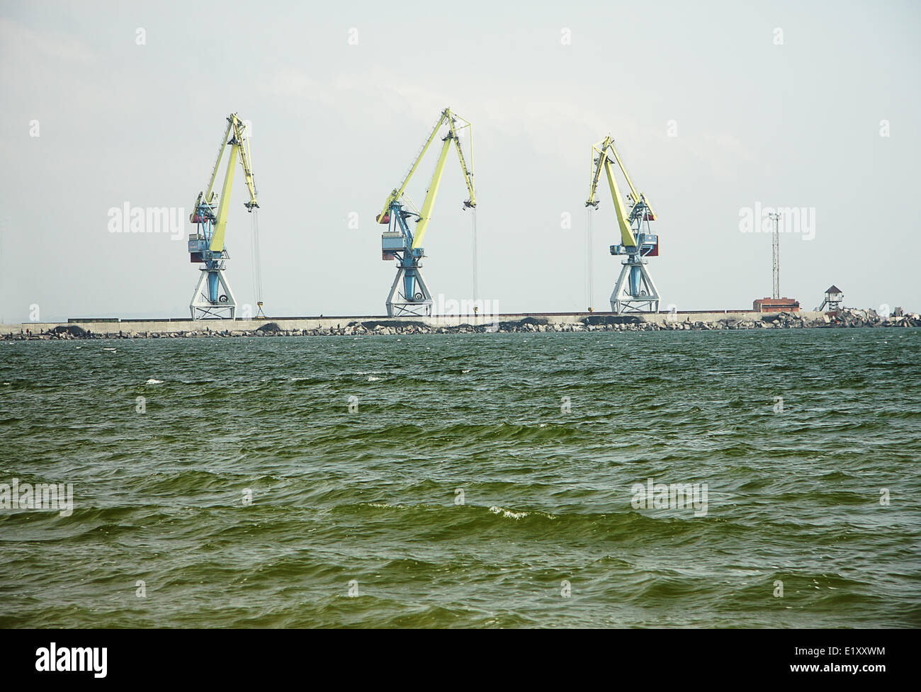Lifting cranes in sea port Stock Photo - Alamy